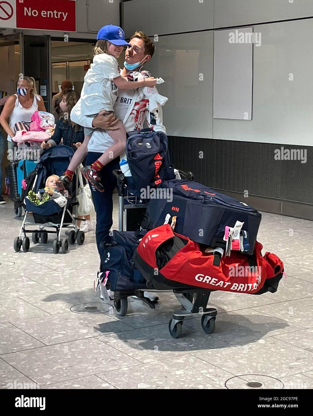 Gold medal winning sailor Dylan Fletcher is reunited at Heathrow ...
