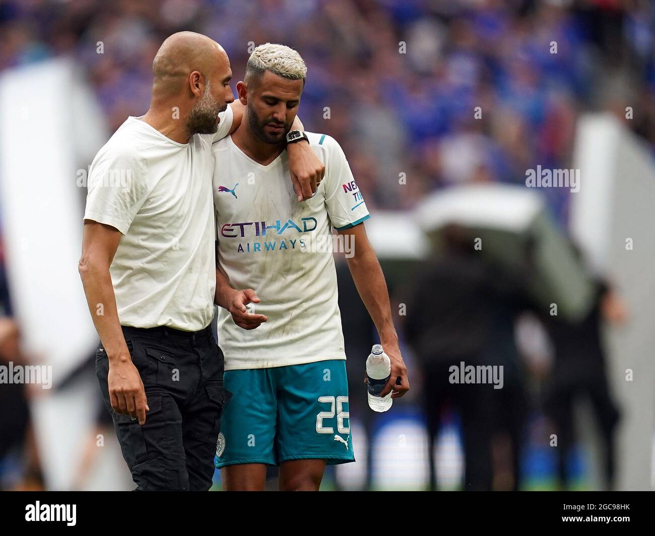 Manchester City manager Pep Guardiola with Riyad Mahrez after the FA ...