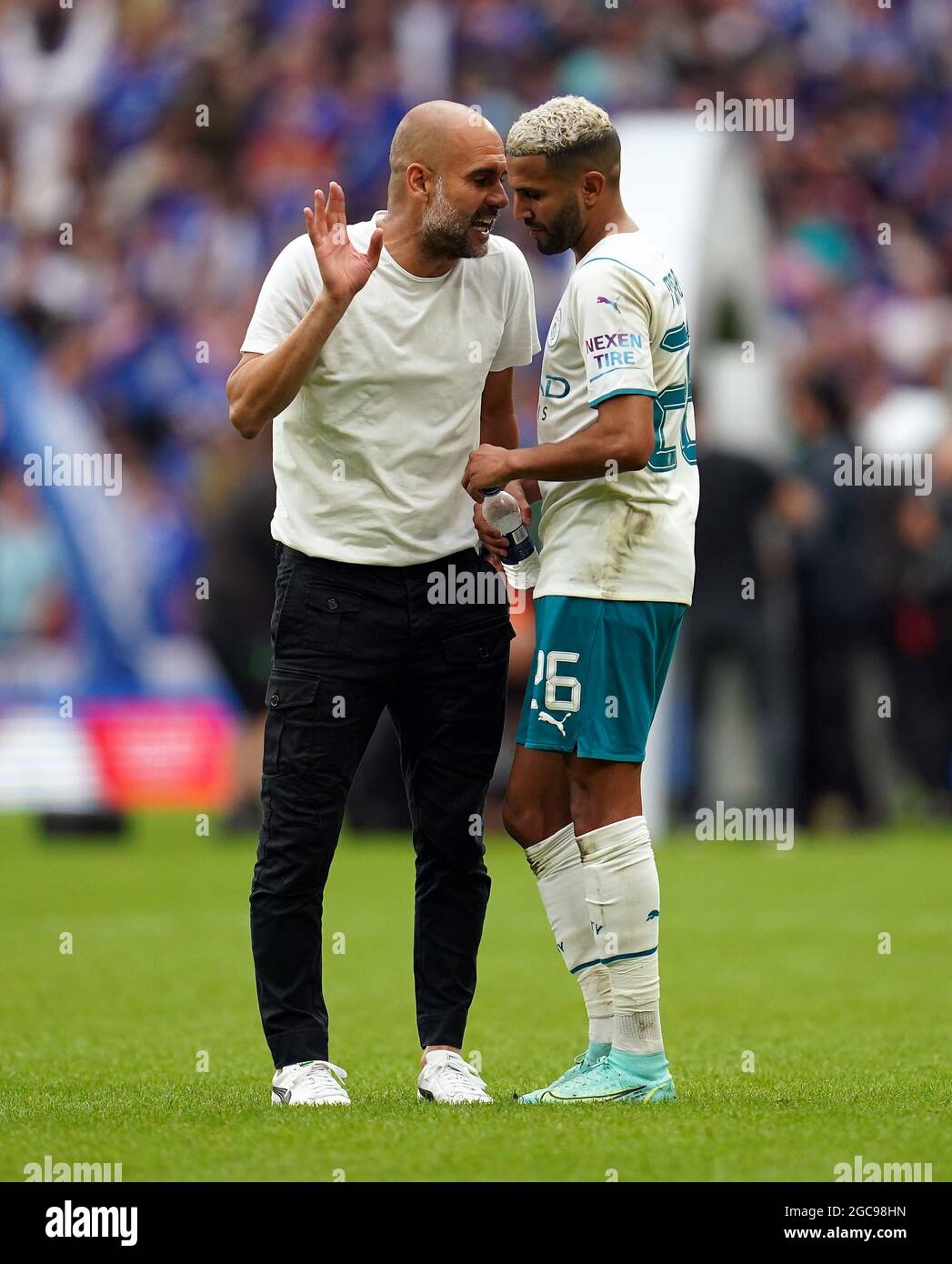 Manchester City manager Pep Guardiola with Riyad Mahrez after the FA ...