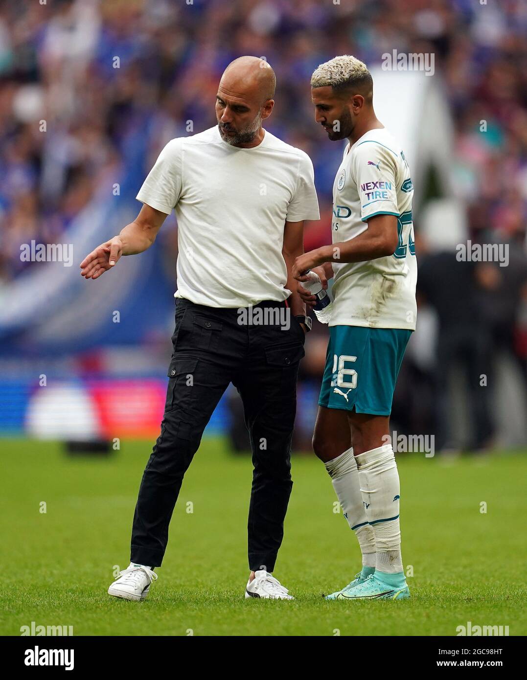 Manchester City manager Pep Guardiola with Riyad Mahrez after the FA ...