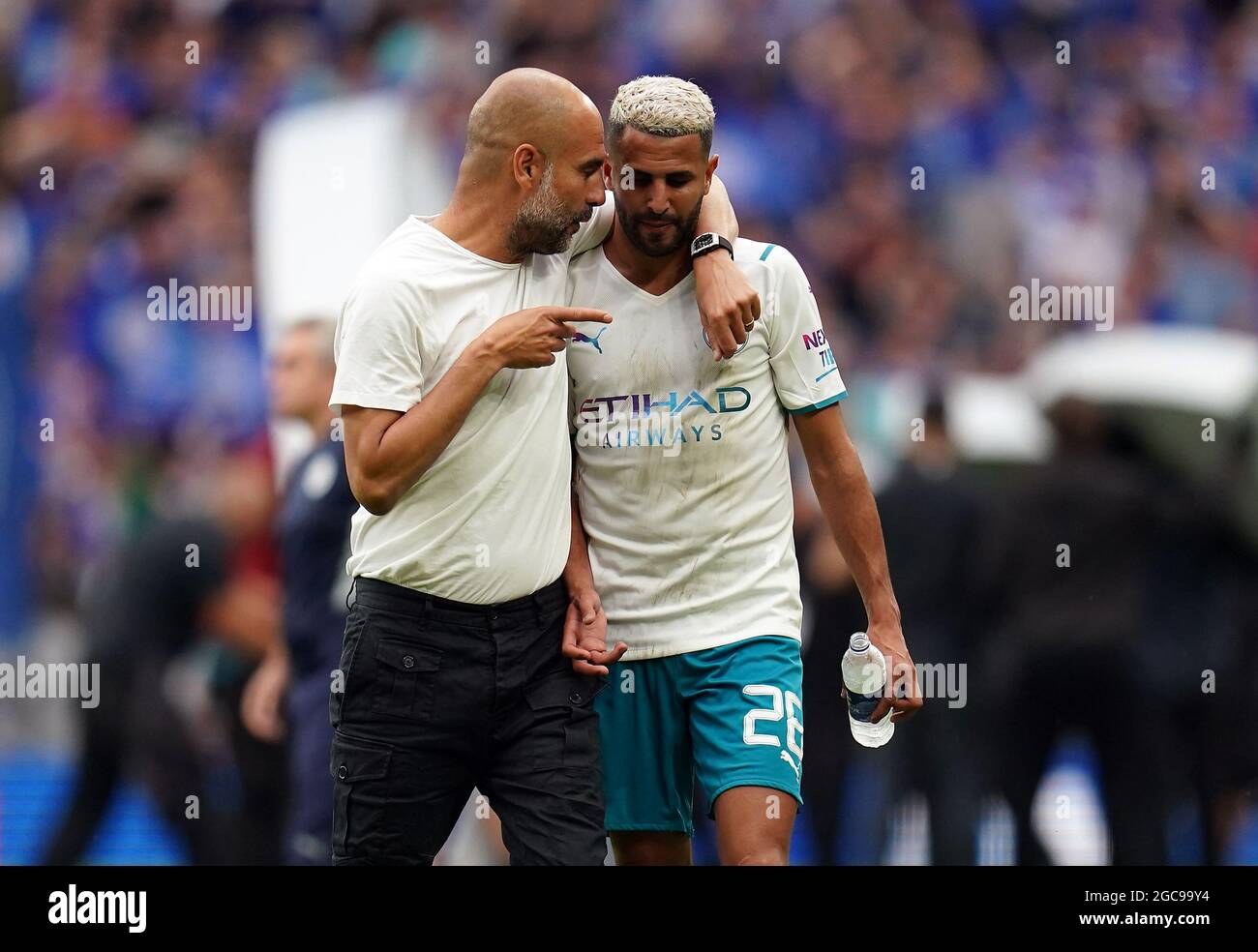 Manchester City manager Pep Guardiola with Riyad Mahrez after the FA ...