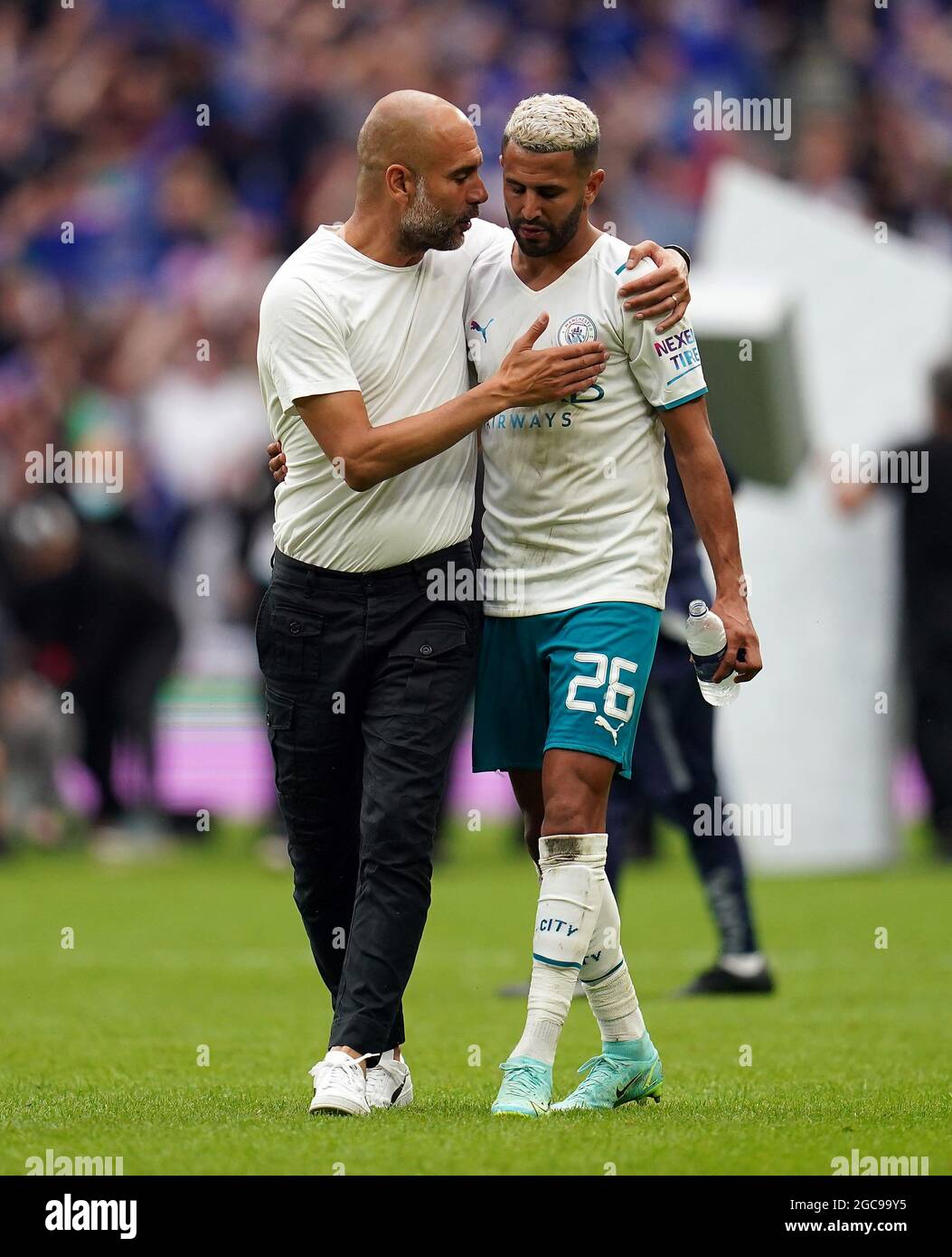 Manchester City manager Pep Guardiola with Riyad Mahrez after the FA ...