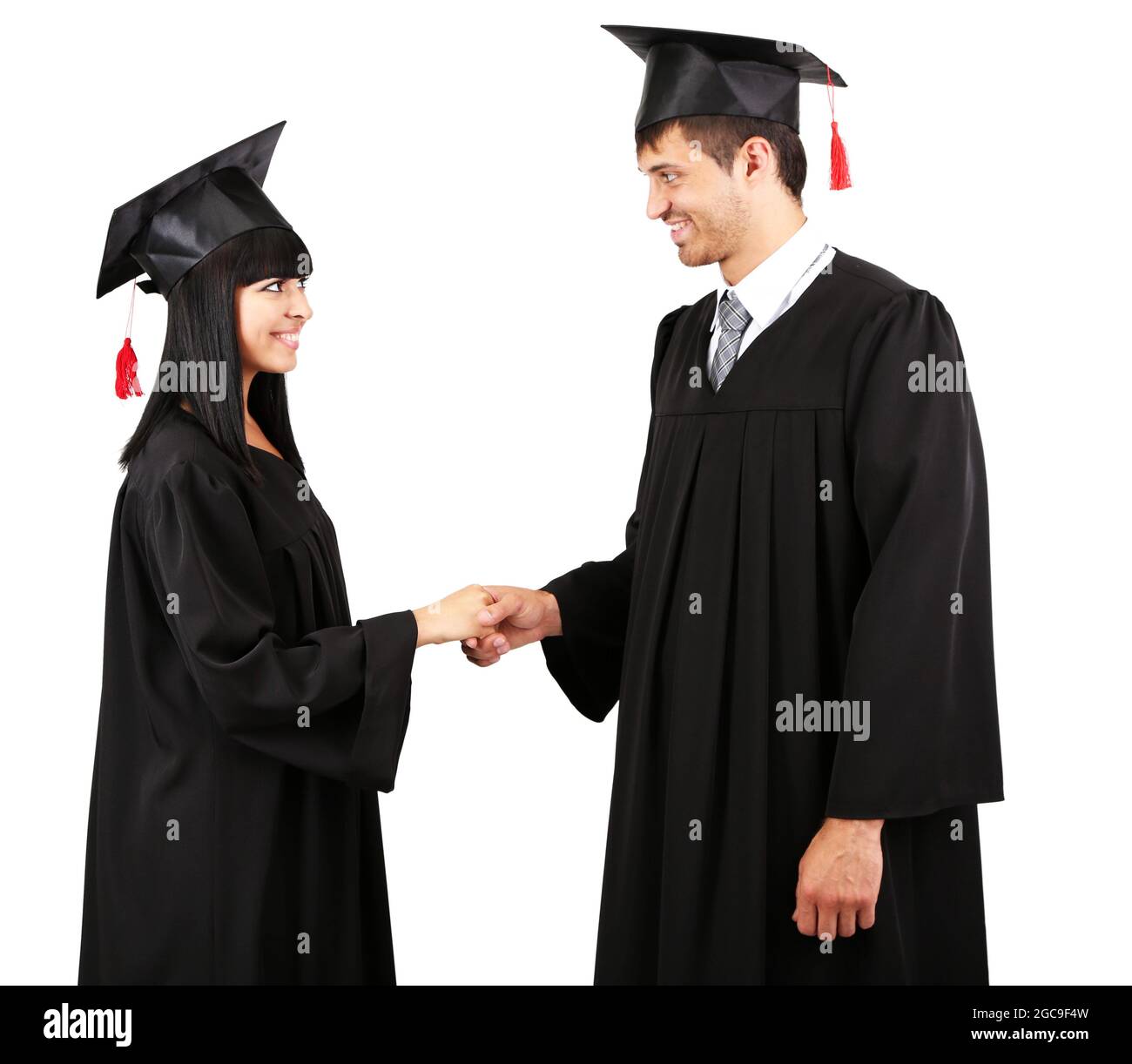 Two happy graduating students isolated on white Stock Photo - Alamy