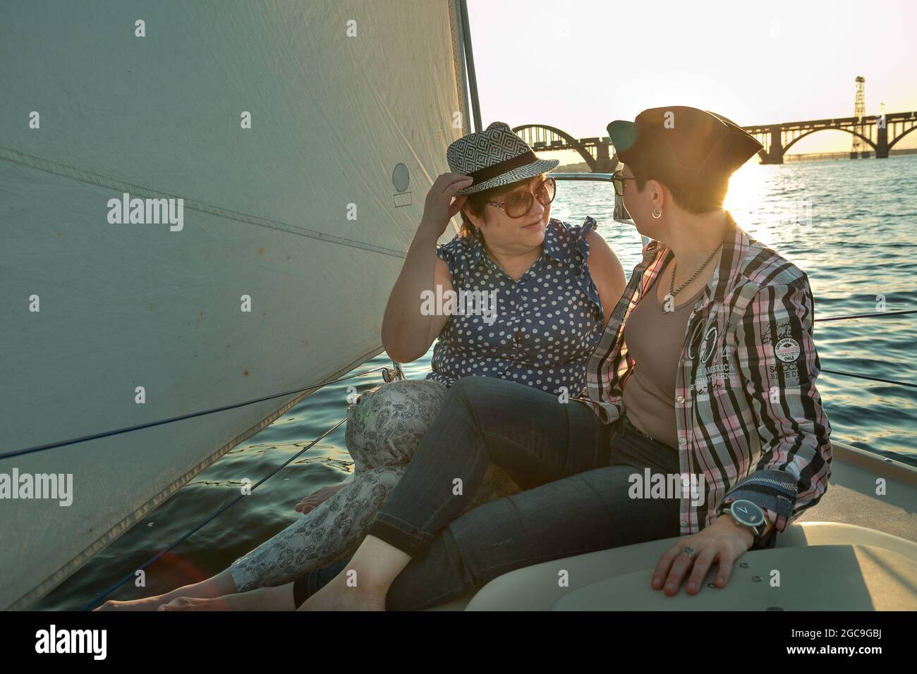 A luxurious yacht vacation. Happy pretty middle aged women girlfriend ...