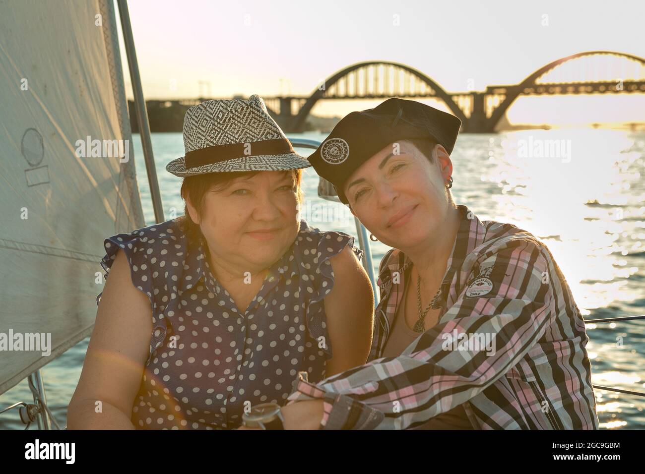 A luxurious yacht vacation. Happy pretty middle aged women girlfriend ...
