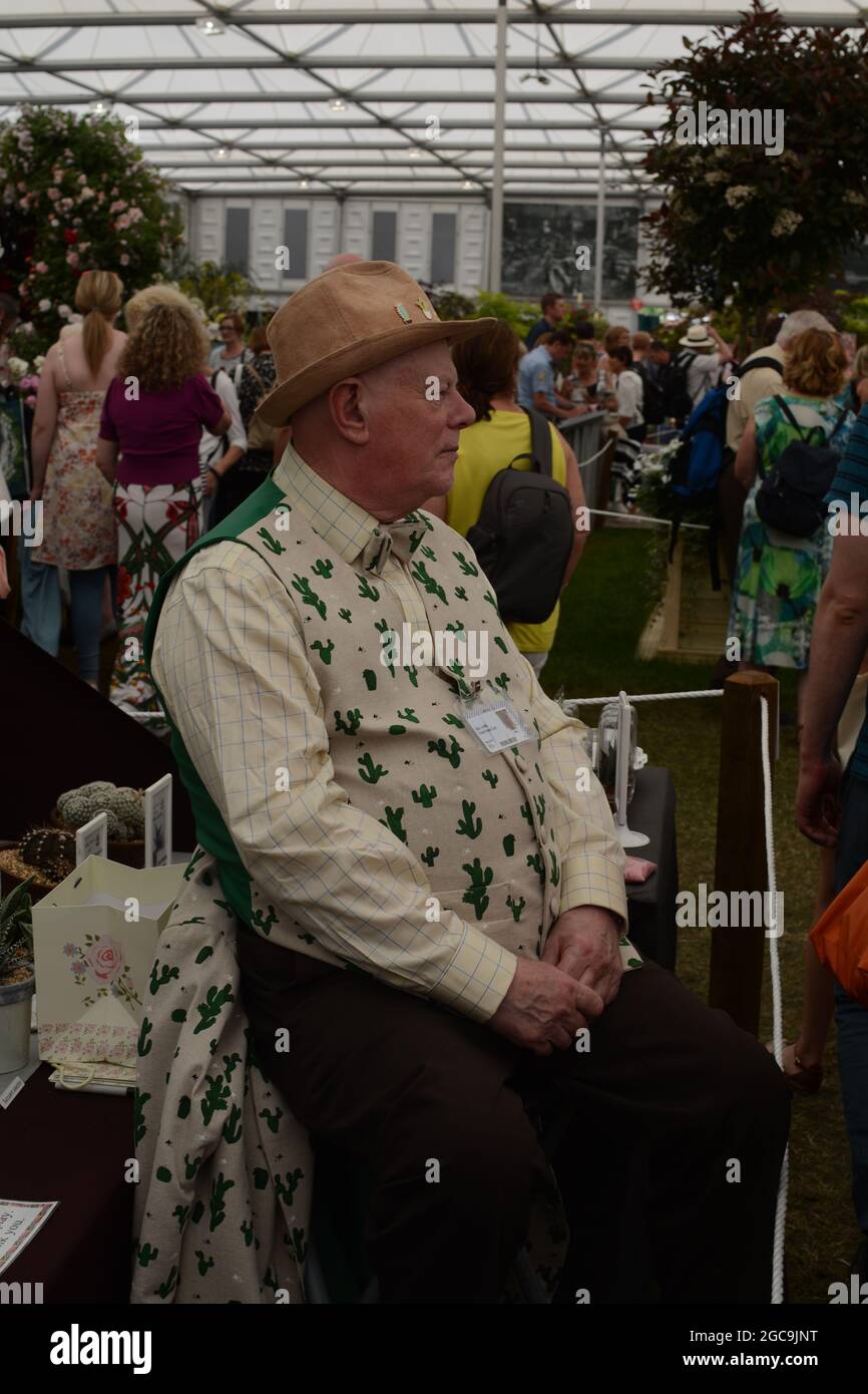 stallholder in hat with plants Stock Photo - Alamy