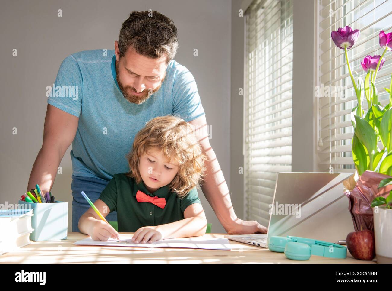 family and parenthood blog. boy do homework with private teacher ...