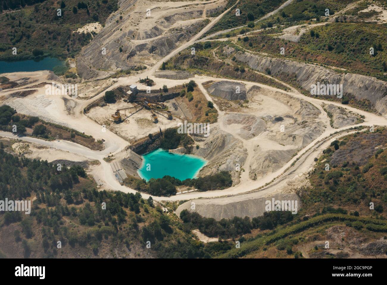 Aerial view of a quarry surrounded by forest Stock Photo - Alamy