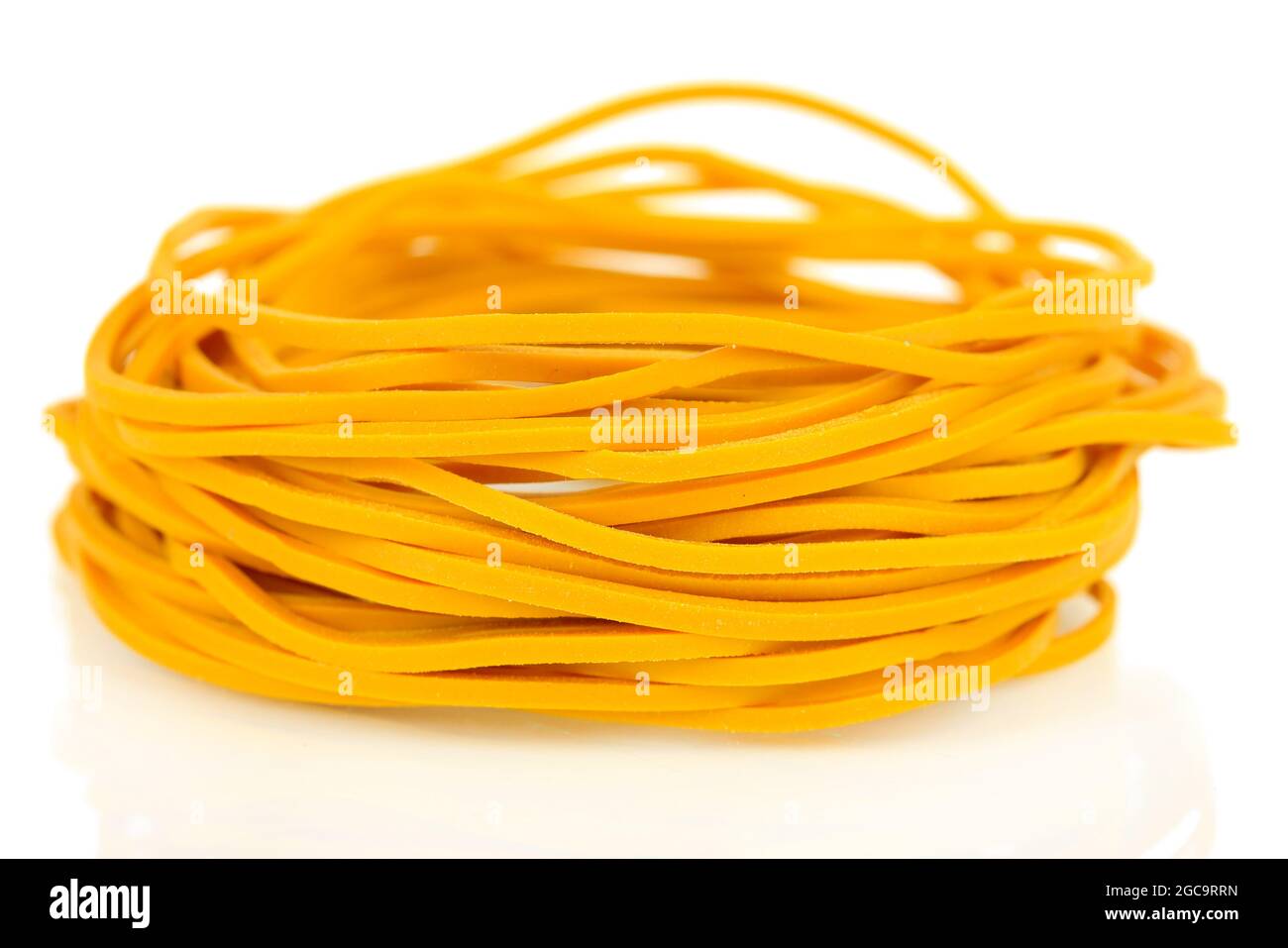 Yellow rubber bands isolated on white Stock Photo - Alamy