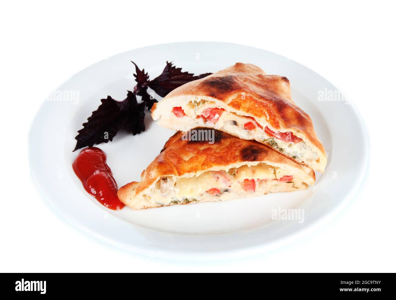 Pizza calzone on plate isolated on white Stock Photo - Alamy