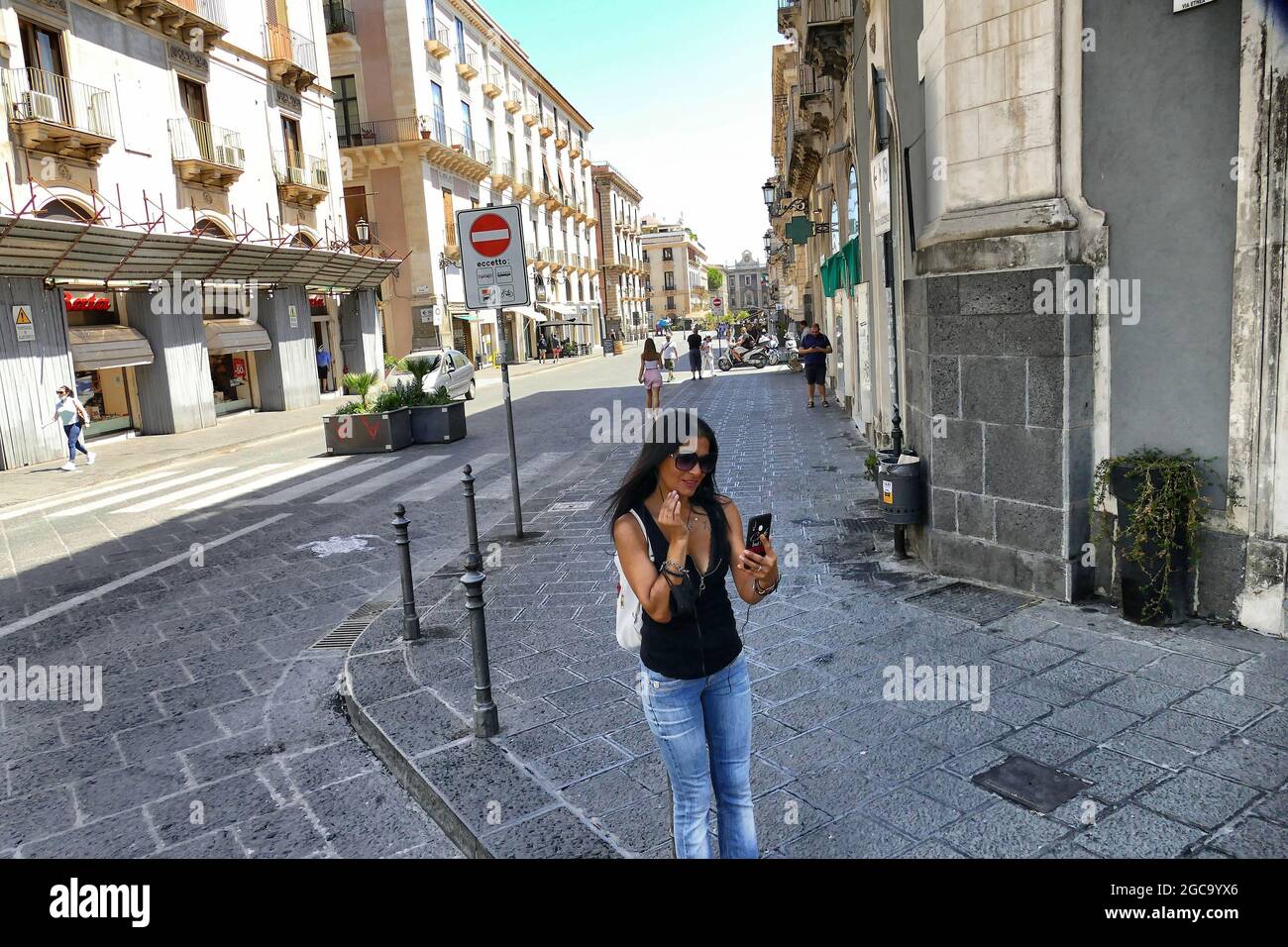 CATANIA, ITALY - Jul 14, 2021: A glimpse of city downtown , the Dome ...