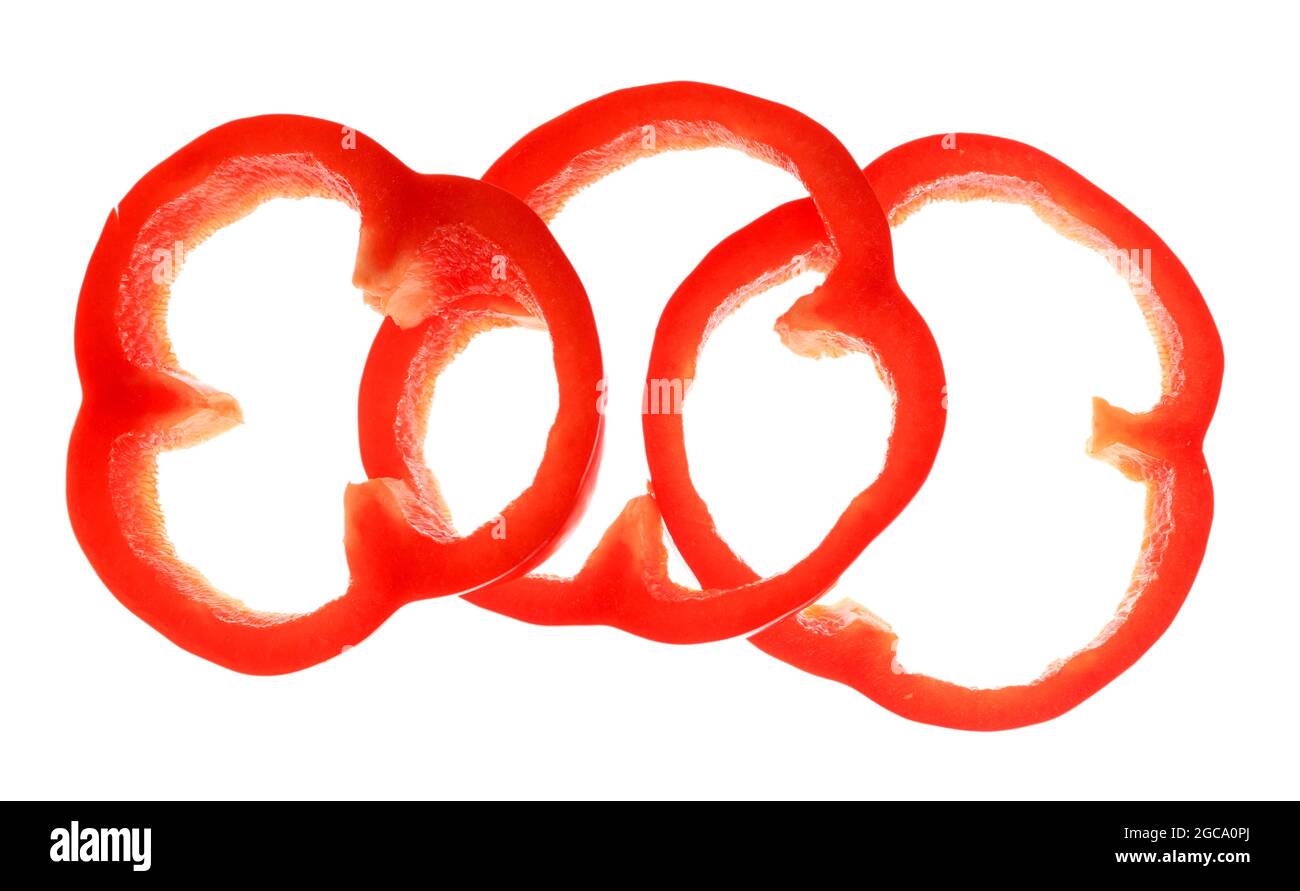 Fresh red pepper slices isolated on white Stock Photo - Alamy