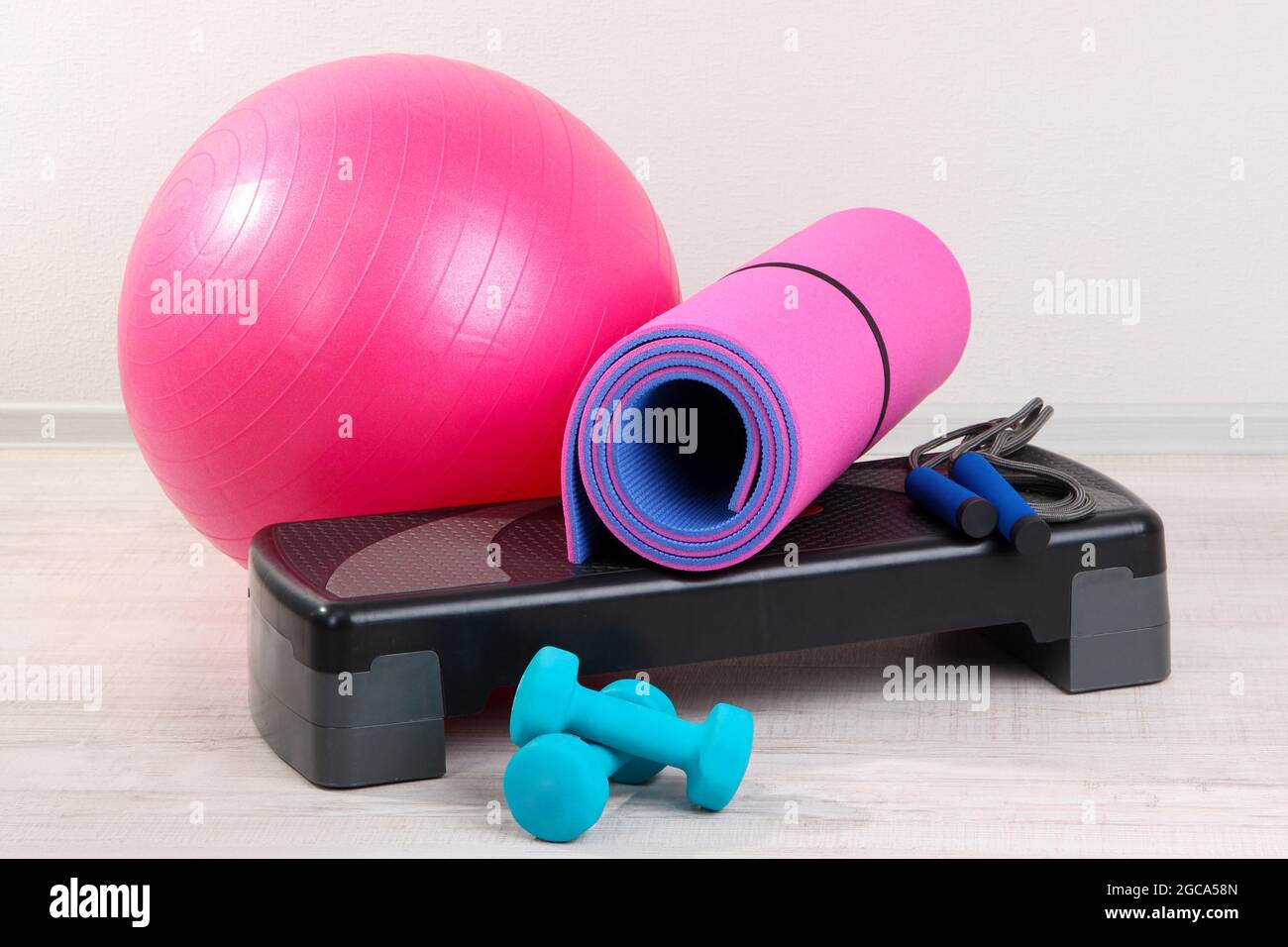 Different tools for fitness in room Stock Photo - Alamy