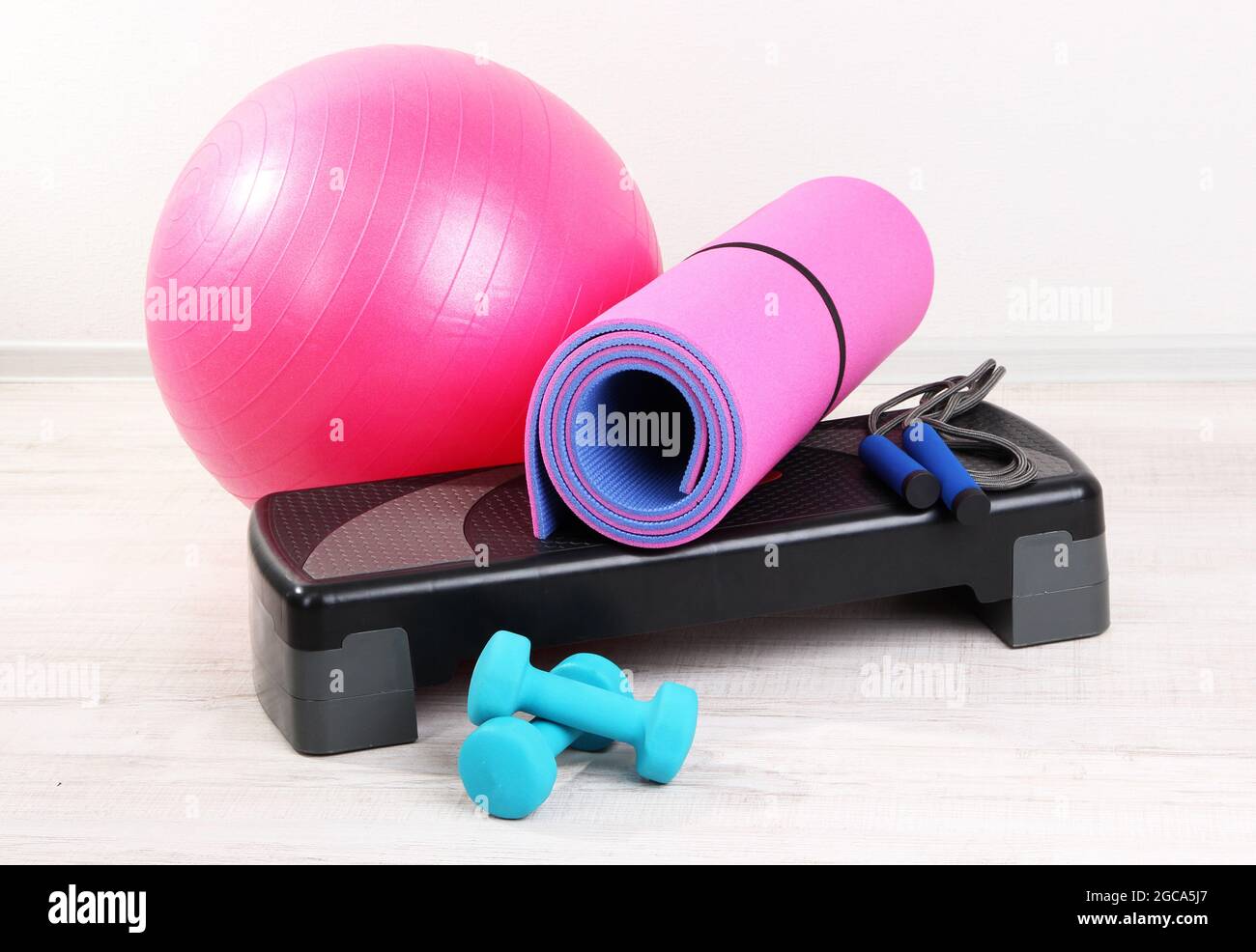 Different tools for fitness in room Stock Photo - Alamy