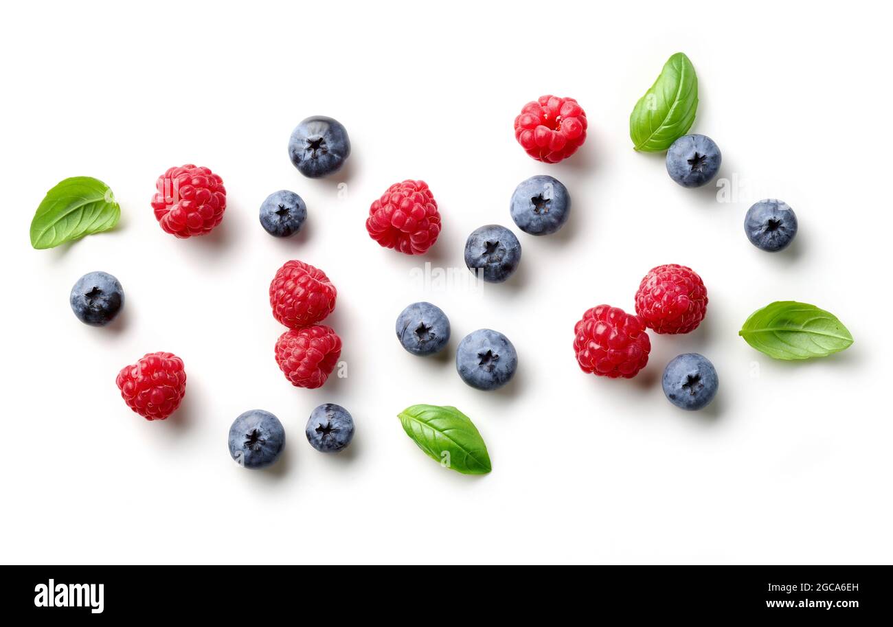 composition of fresh berries and green leaves isolated on white ...