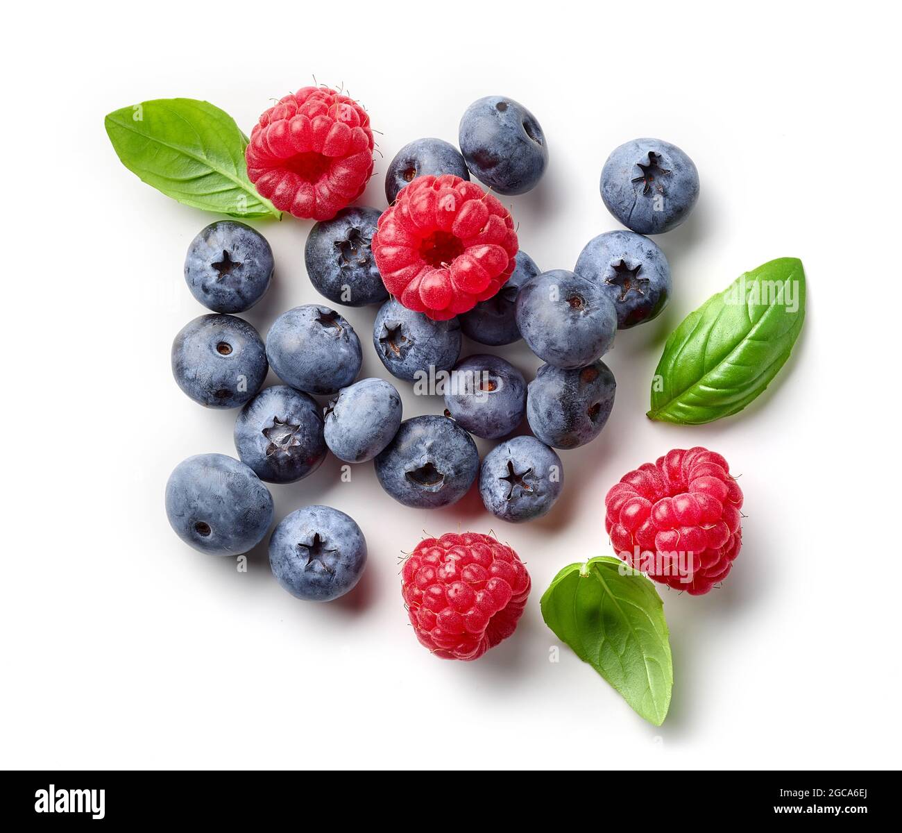 composition of fresh berries and green leaves isolated on white ...