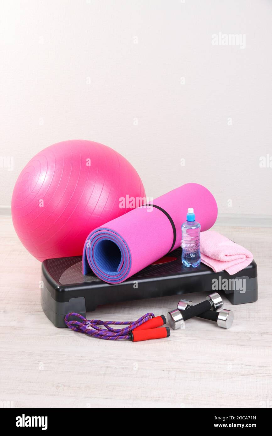 Different tools for fitness in room Stock Photo - Alamy