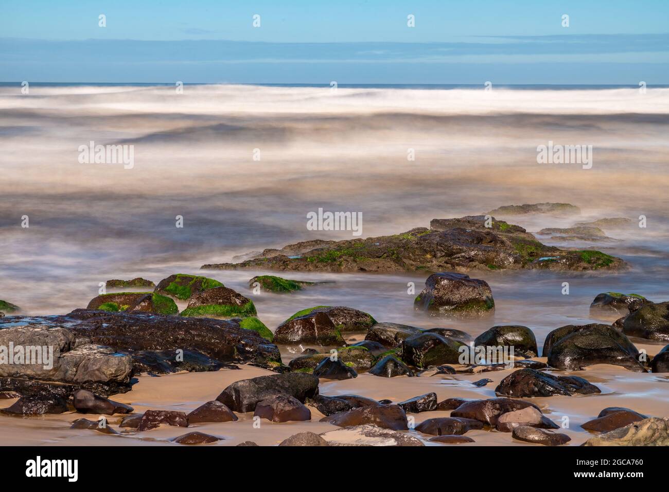 Sand, rocks and waves in a beach, Torres, Rio Grande do Sul, Brazil ...