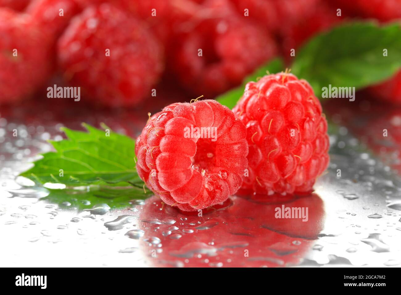 Ripe sweet raspberries with drops, close up Stock Photo - Alamy