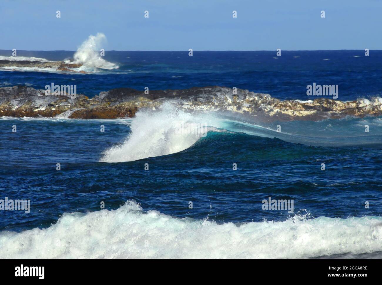 Three levels of white water are illustrated in this deep aqua expanse ...