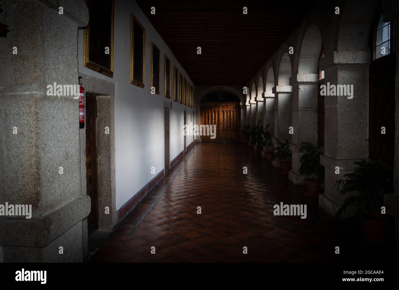 Inside view of an old empty hallway with sunlight passing through glass ...
