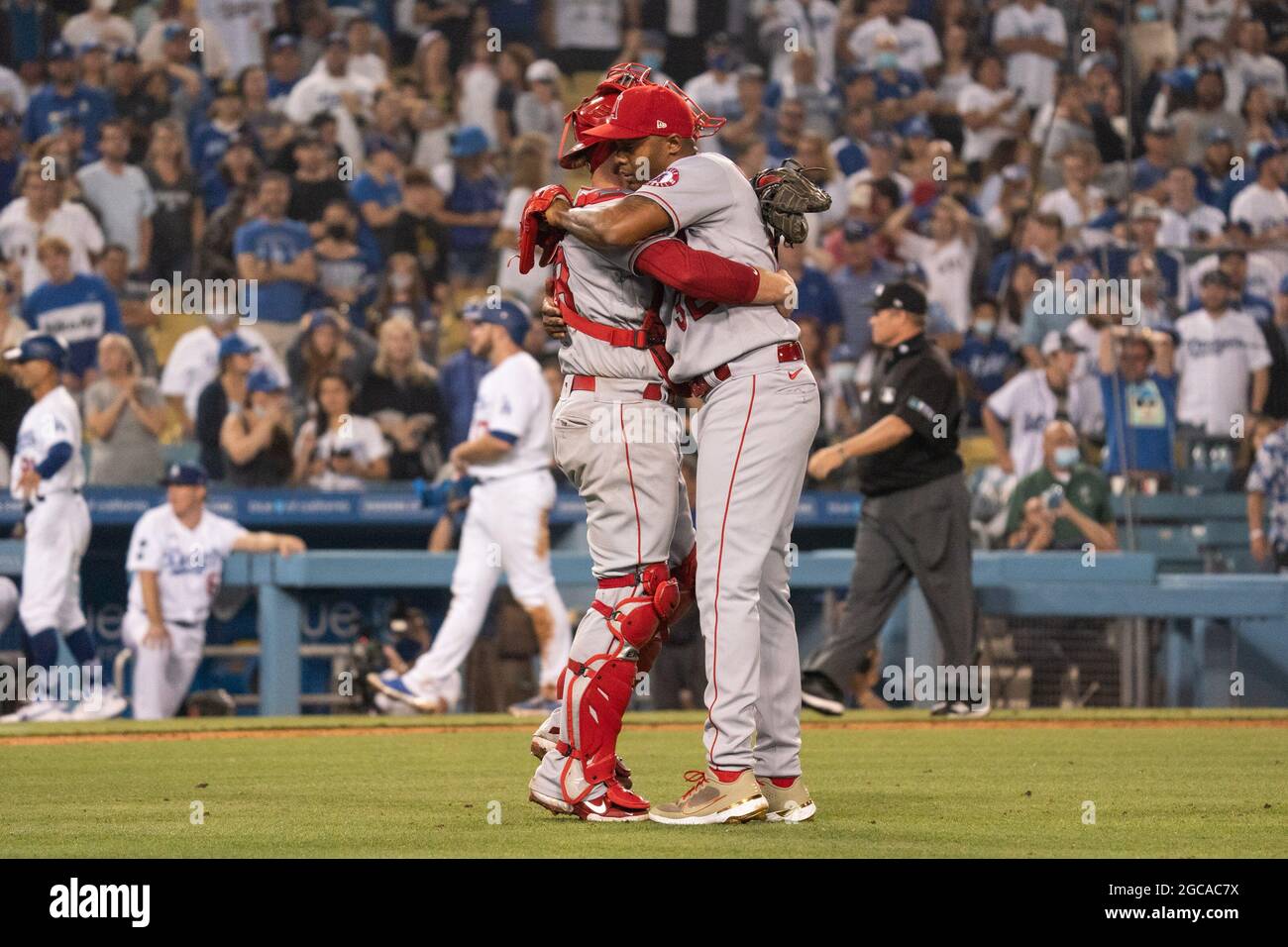 Los Angeles Angels catcher Max Stassi (33) and relief pitcher Raisel ...