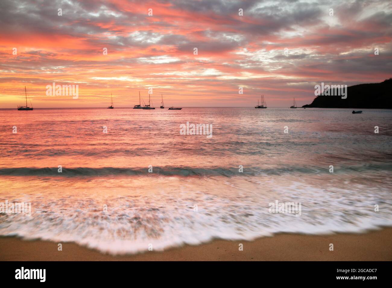 a sunset over a body of water Stock Photo - Alamy