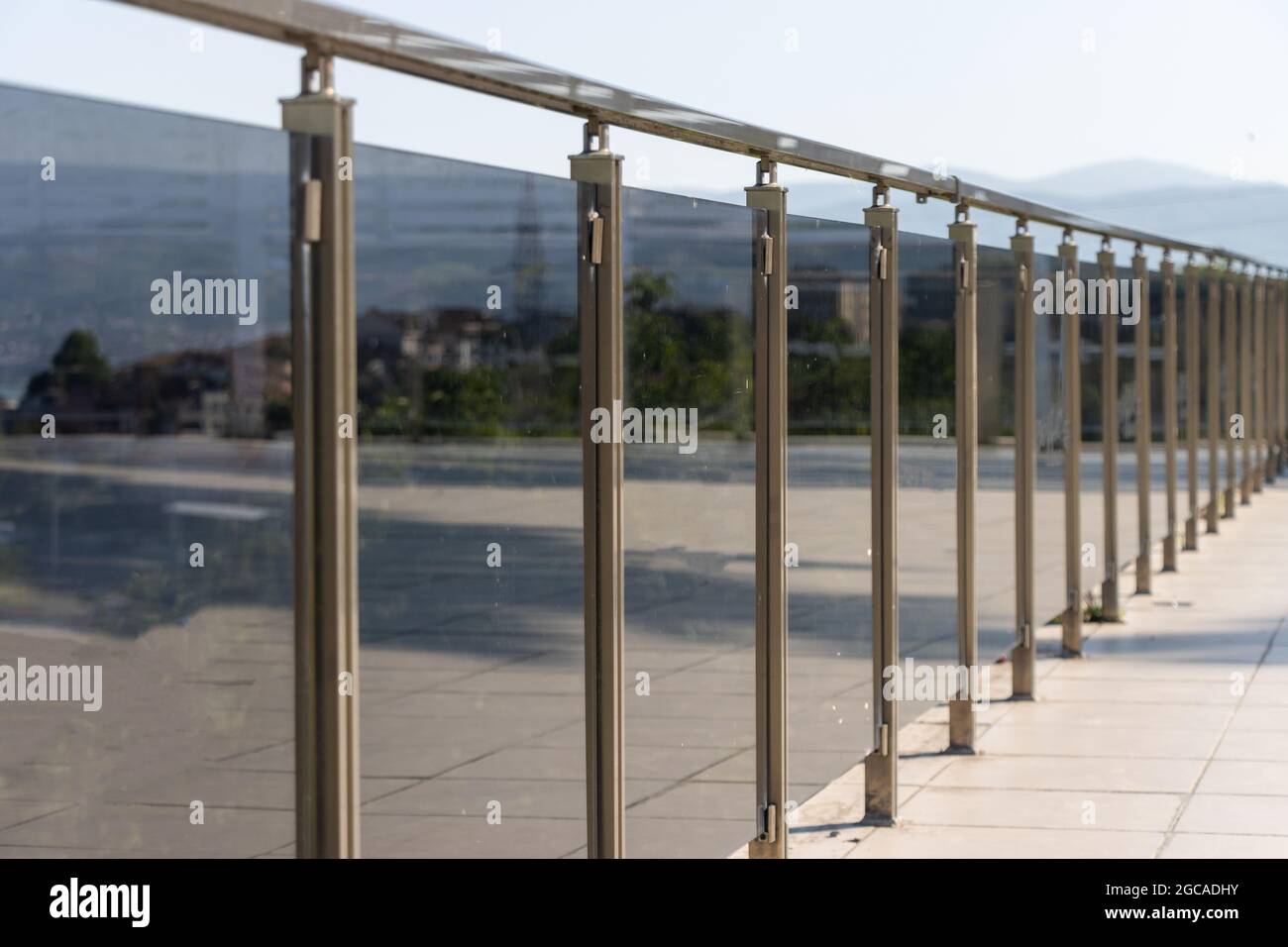 Metal and glass wrought iron fence railings Stock Photo - Alamy