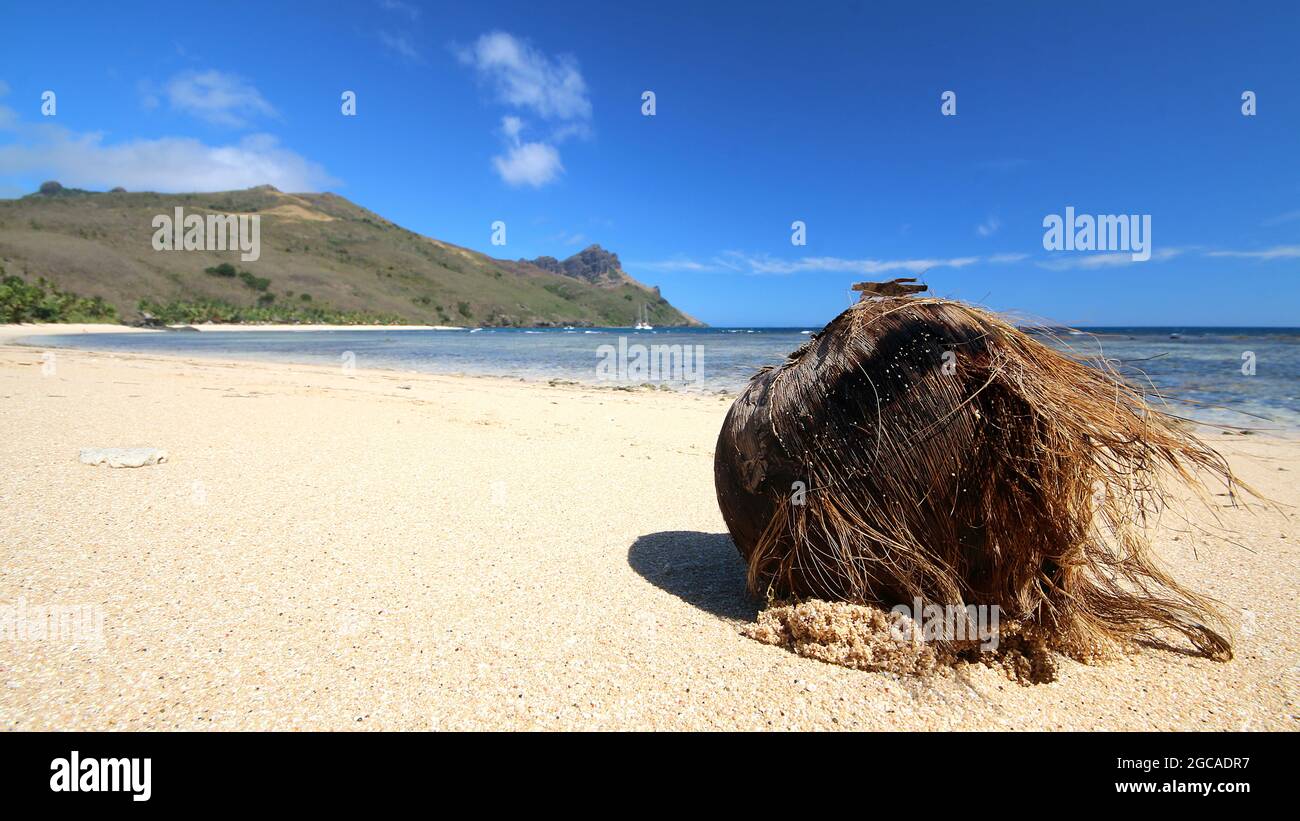 a rocky beach next to a body of water Stock Photo - Alamy