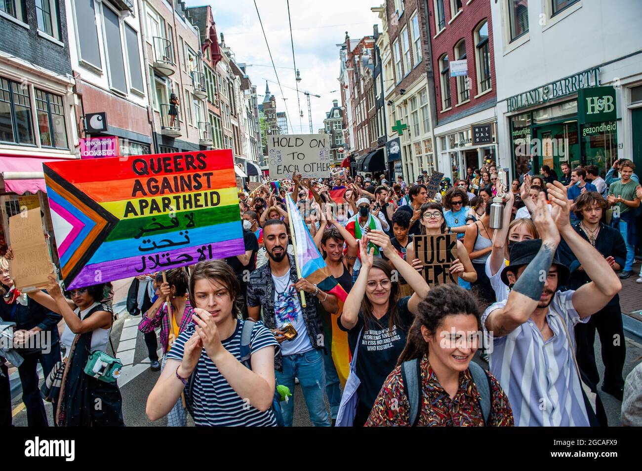 Amsterdam, Netherlands. 07th Aug, 2021. Protesters are seen clapping ...