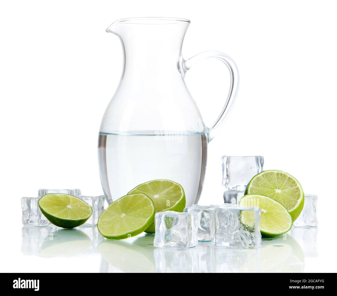 Glass pitcher of water with ice and lime isolated on white Stock Photo ...