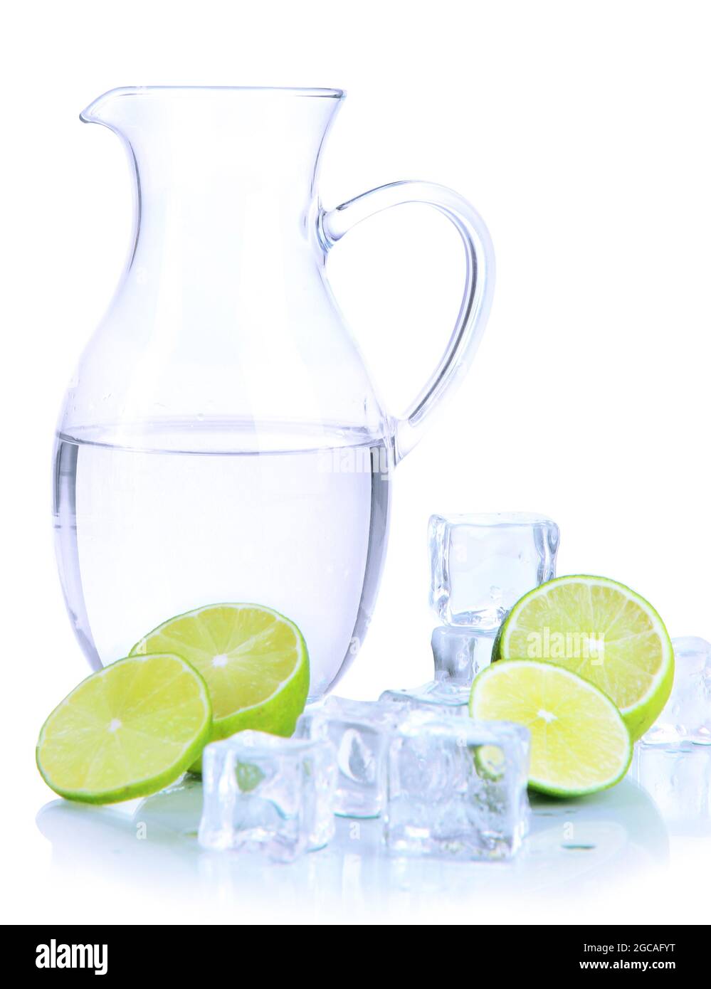 Glass pitcher of water with ice and lime isolated on white Stock Photo ...