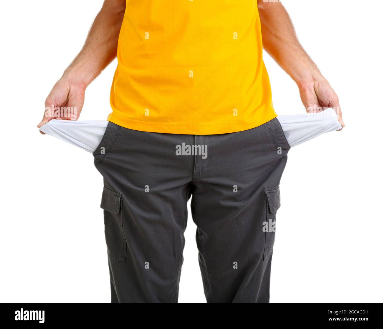 Man showing his empty pockets, isolated on white Stock Photo - Alamy