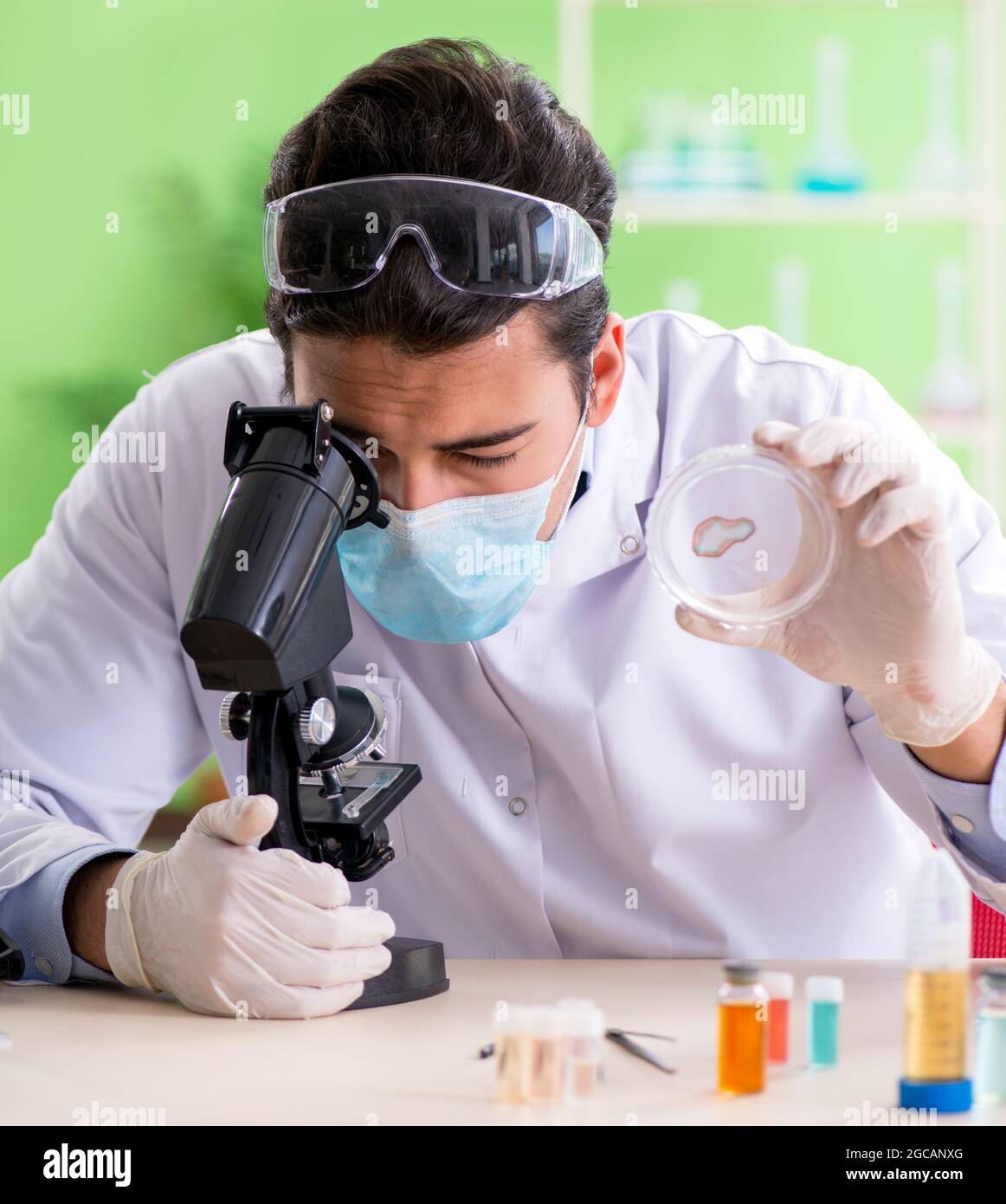 The man chemist working in the lab Stock Photo - Alamy