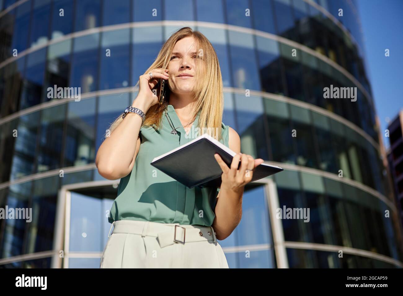 Serious woman talking note book hi-res stock photography and images - Alamy