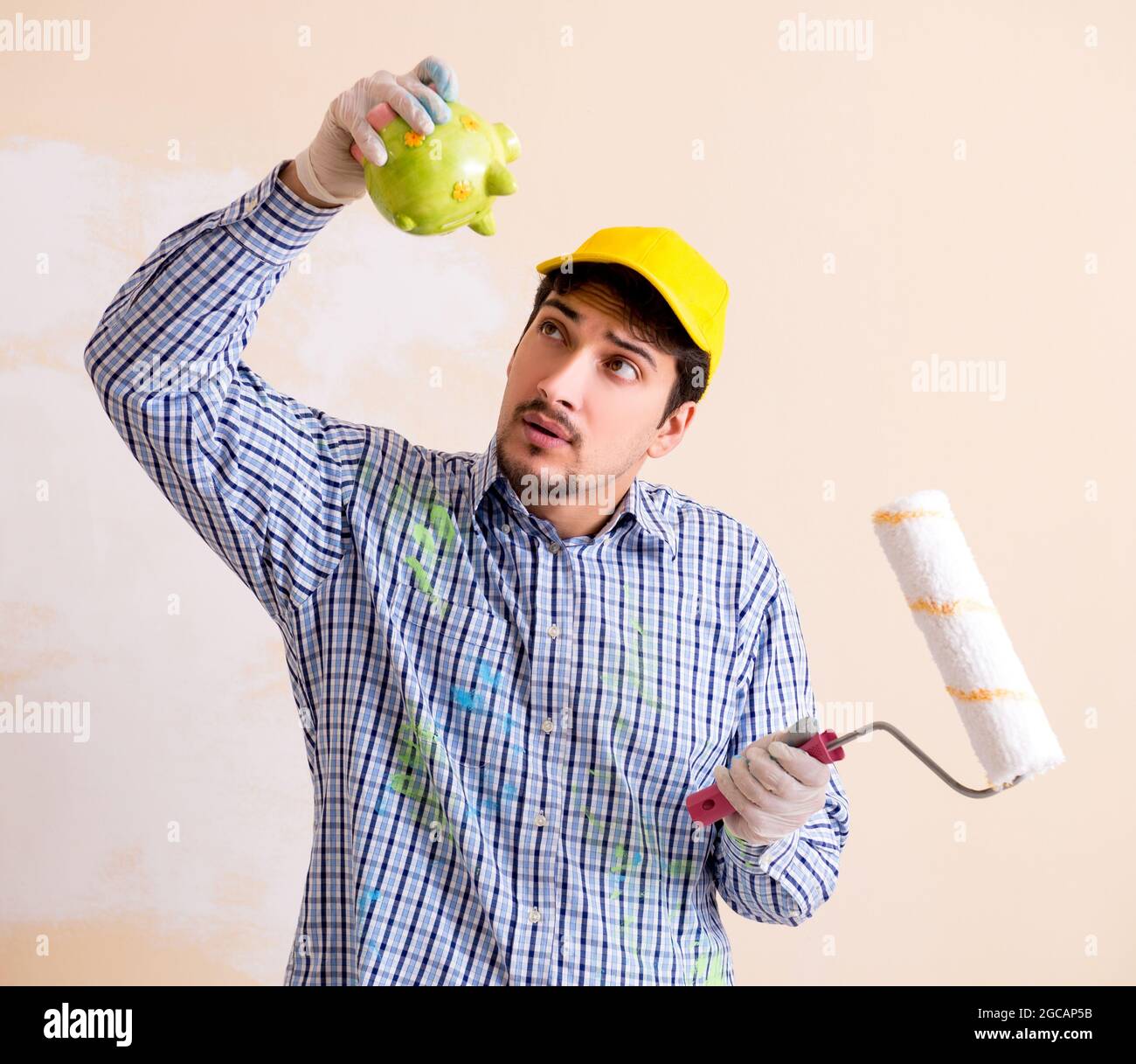 The painter man painting the wall at home Stock Photo - Alamy