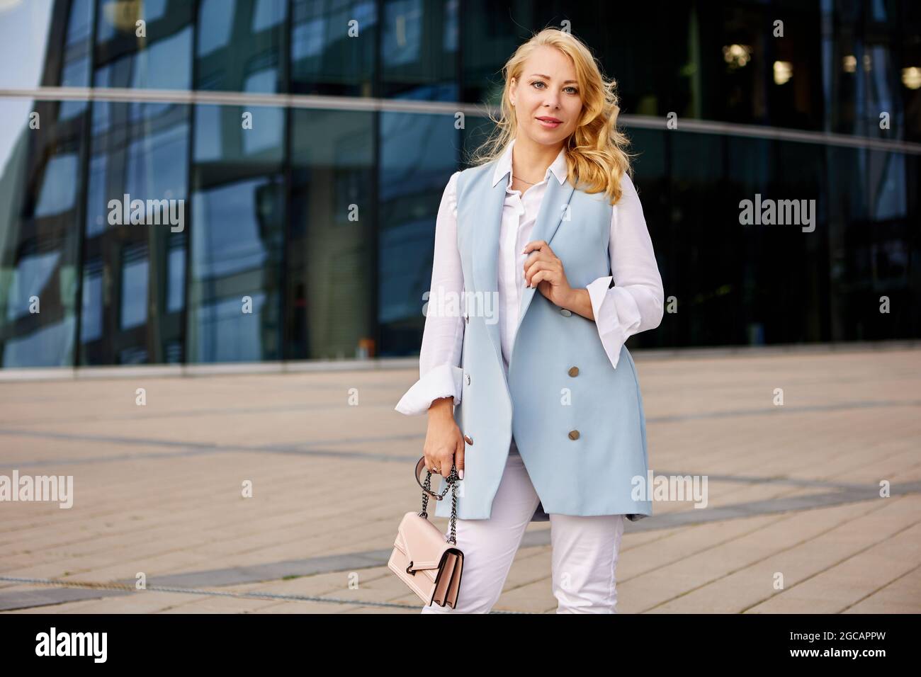 Financial advisor in business suit stands near office center Stock ...