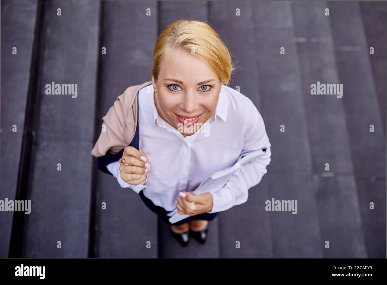 Secretary standing on stairs hi-res stock photography and images - Alamy