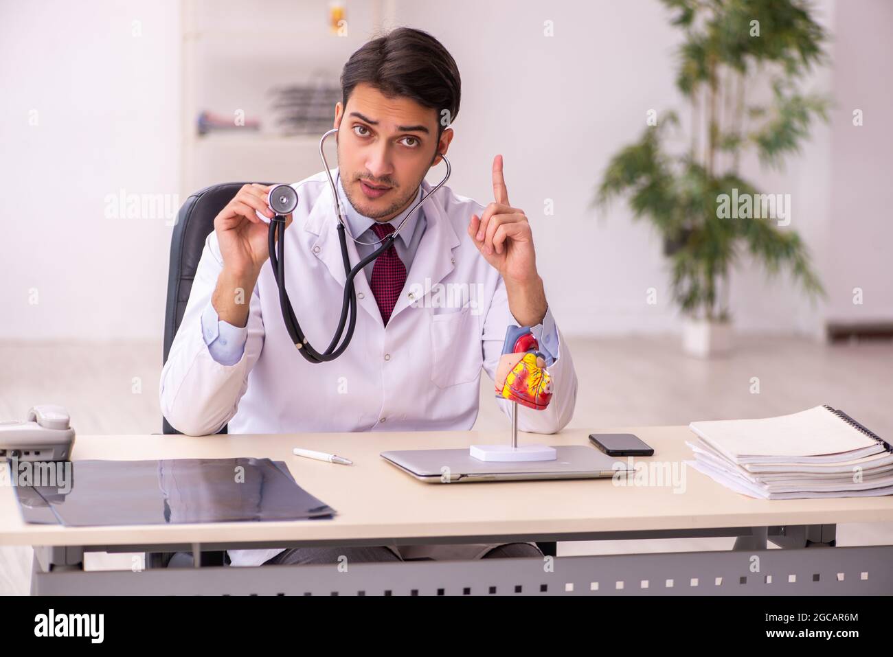 Young male doctor cardiologist working at the hospital Stock Photo - Alamy