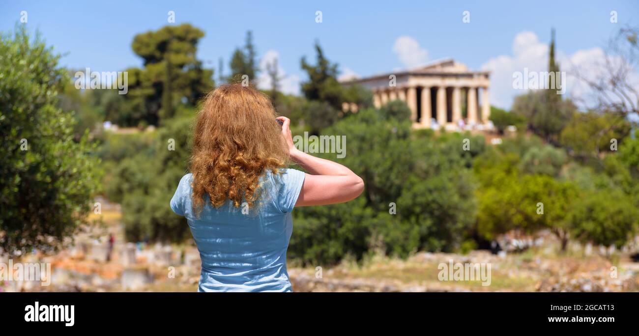 Girl tourist takes photo of Athens, Greece, Europe. Temple of ...