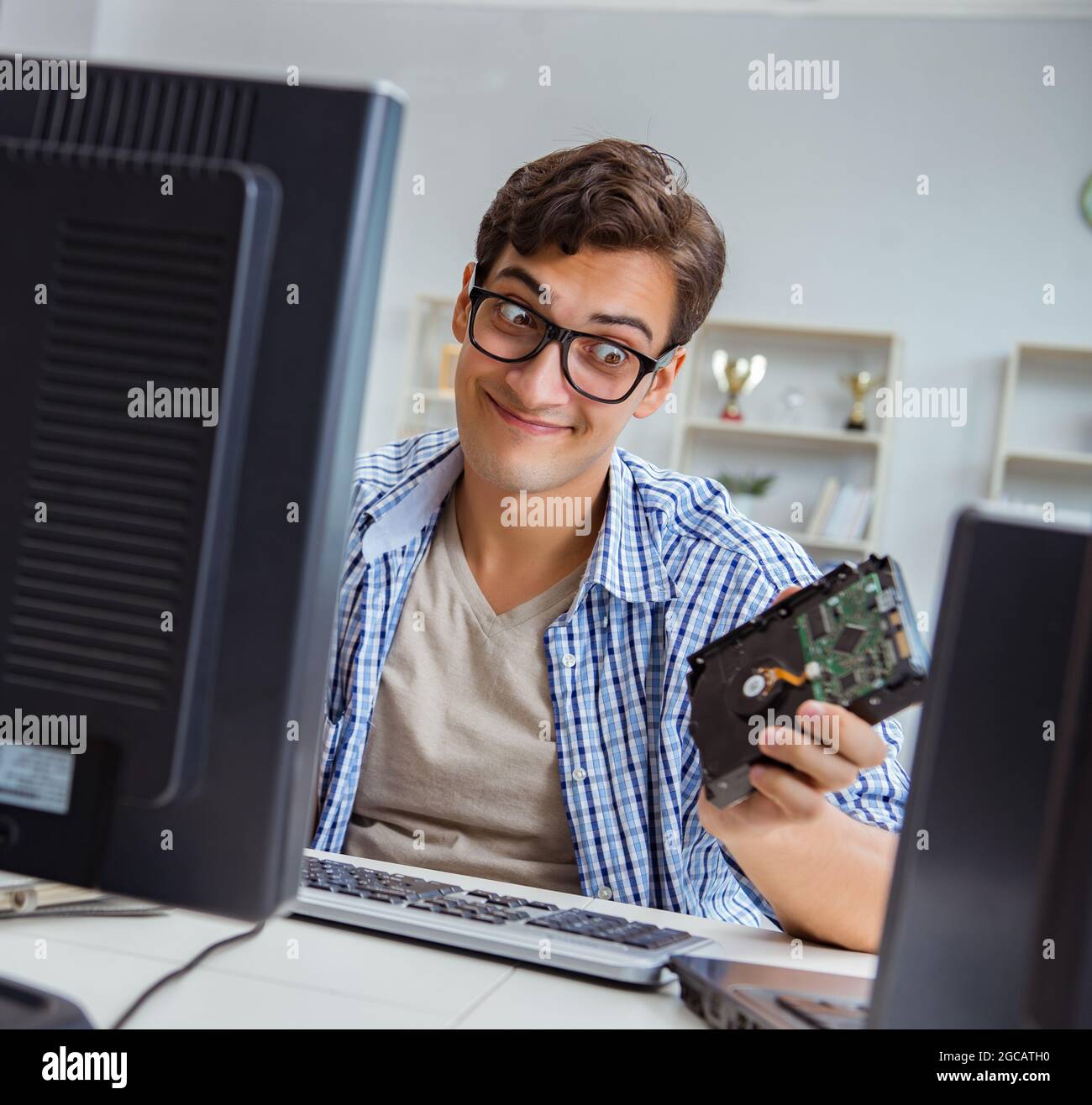 The technician with broken hard drive Stock Photo - Alamy