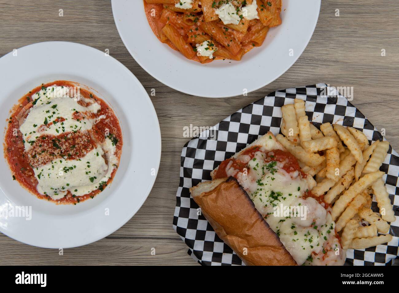 Buffet of food on the table family style with the meatball sub sandwich ...