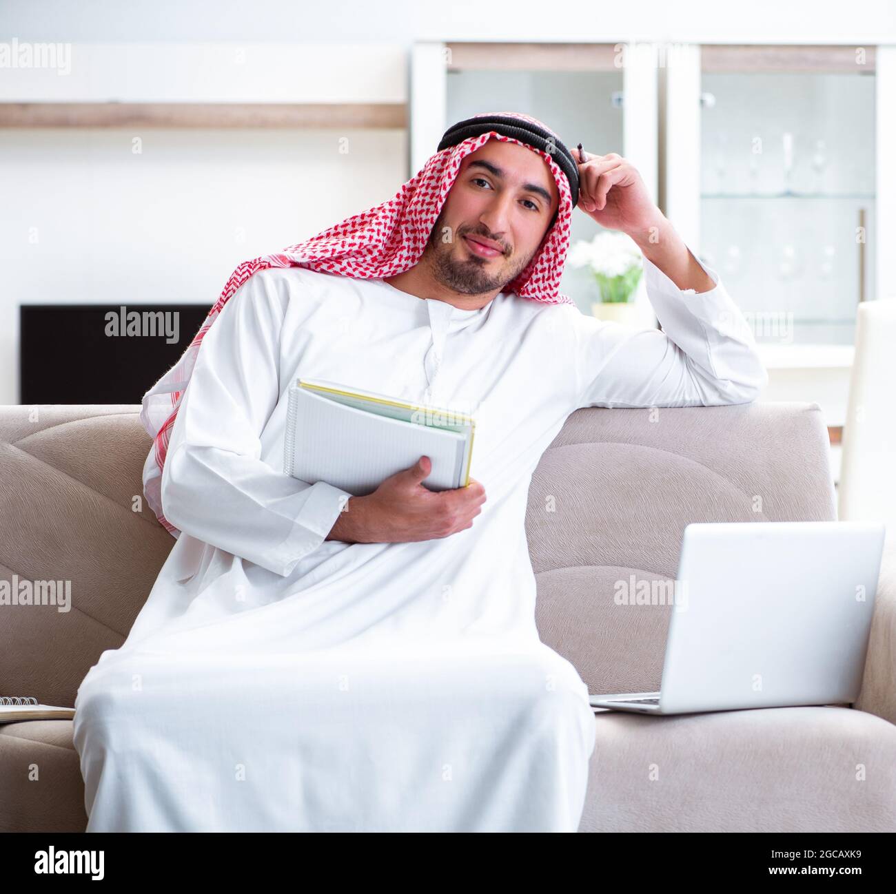 The arab man working at home on his work Stock Photo - Alamy