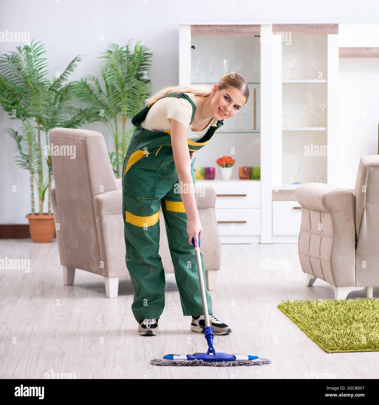The woman female cleaner cleaning floor Stock Photo - Alamy