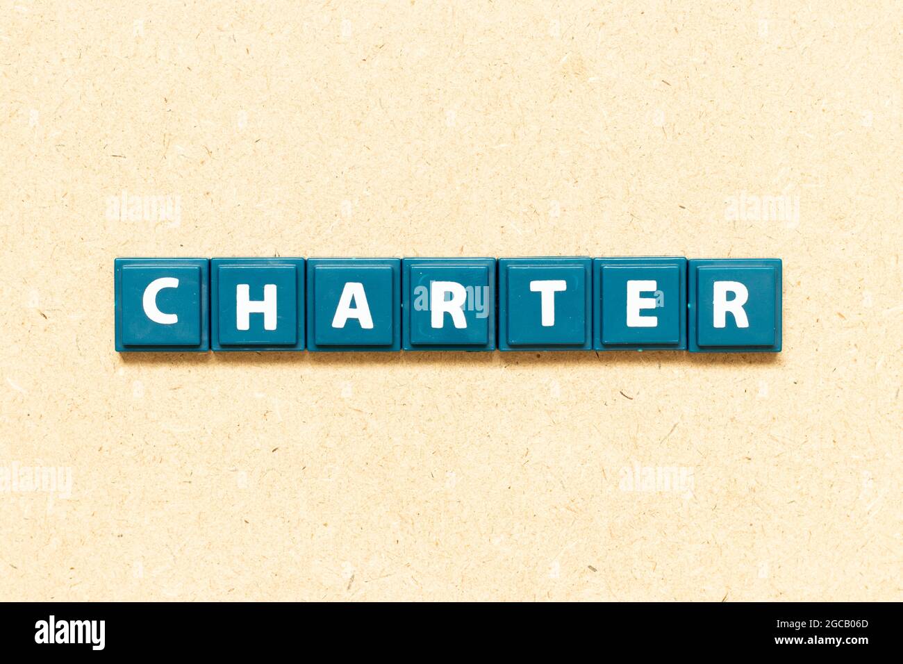 Tile alphabet letter in word charter on wood background Stock Photo - Alamy