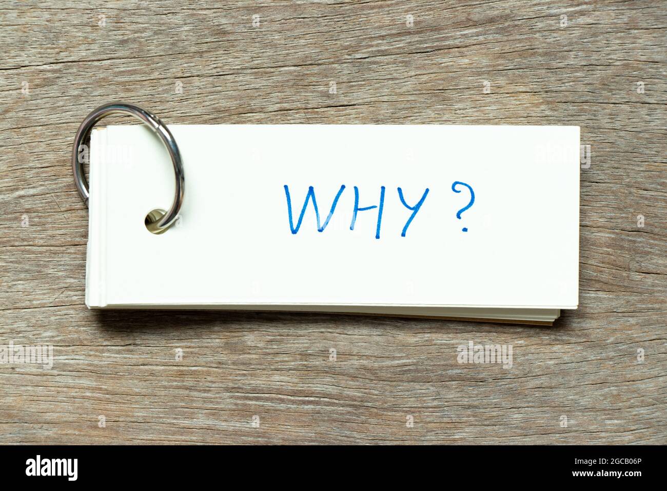 Flash card with handwriting word why on wood background Stock Photo - Alamy