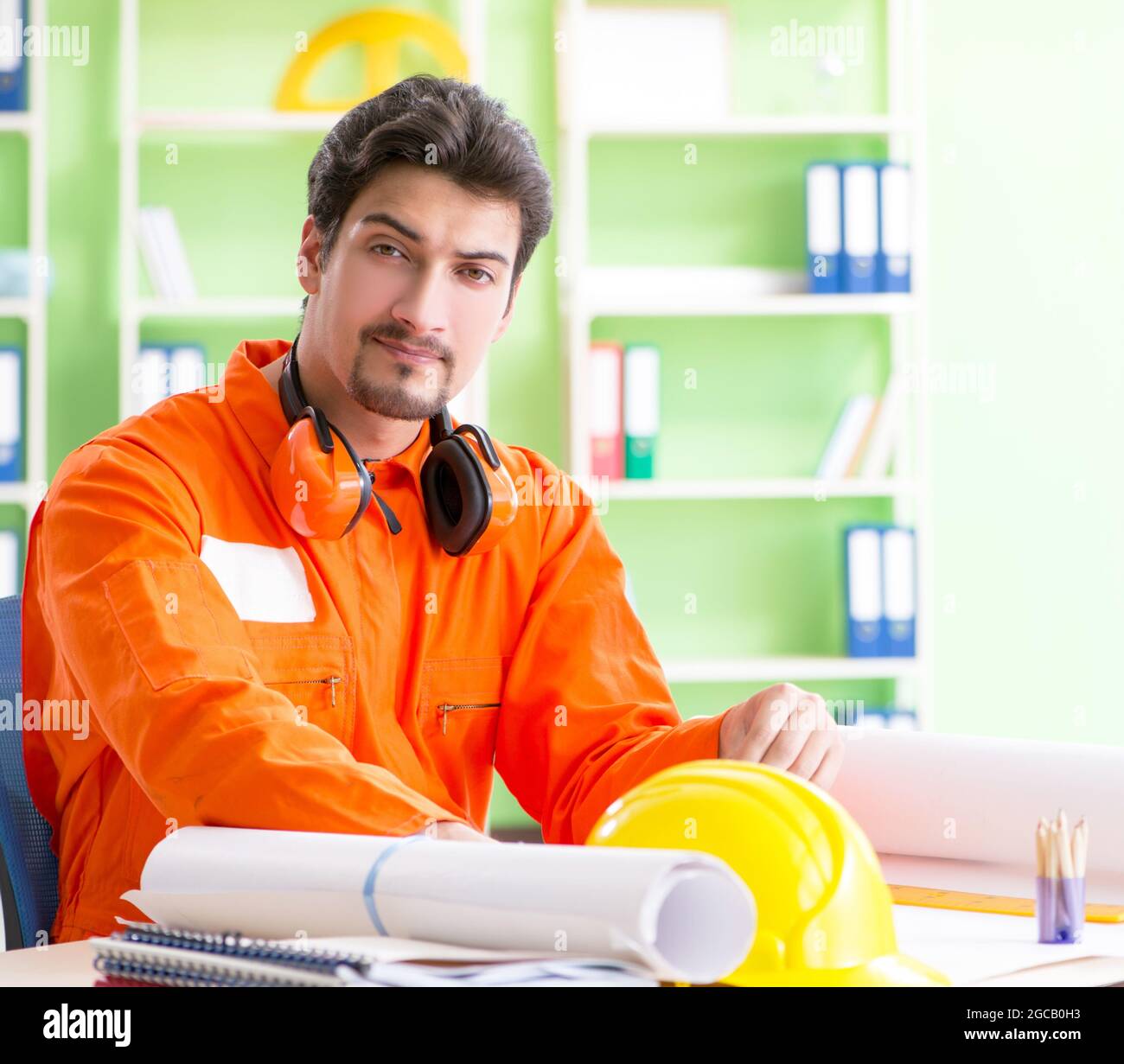 The construction supervisor planning new project in office Stock Photo ...