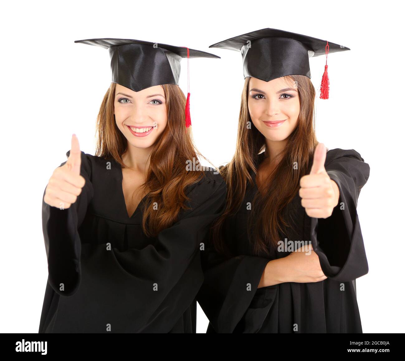 Two happy graduating students isolated on white Stock Photo - Alamy