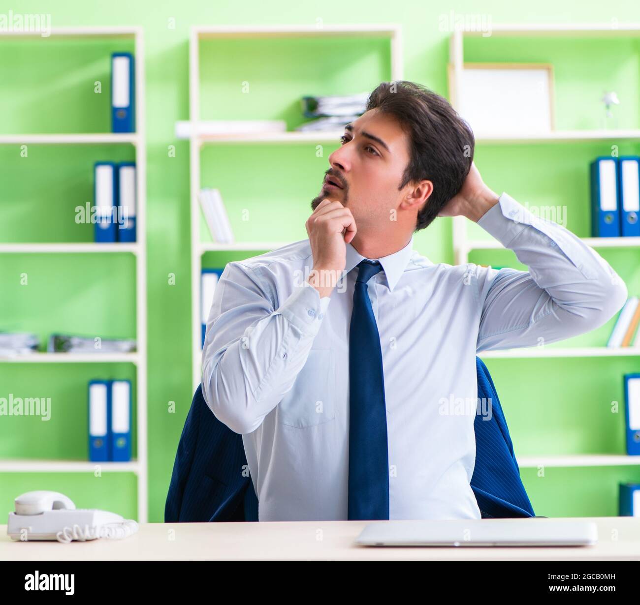 The employee doing exercises during break at work Stock Photo - Alamy