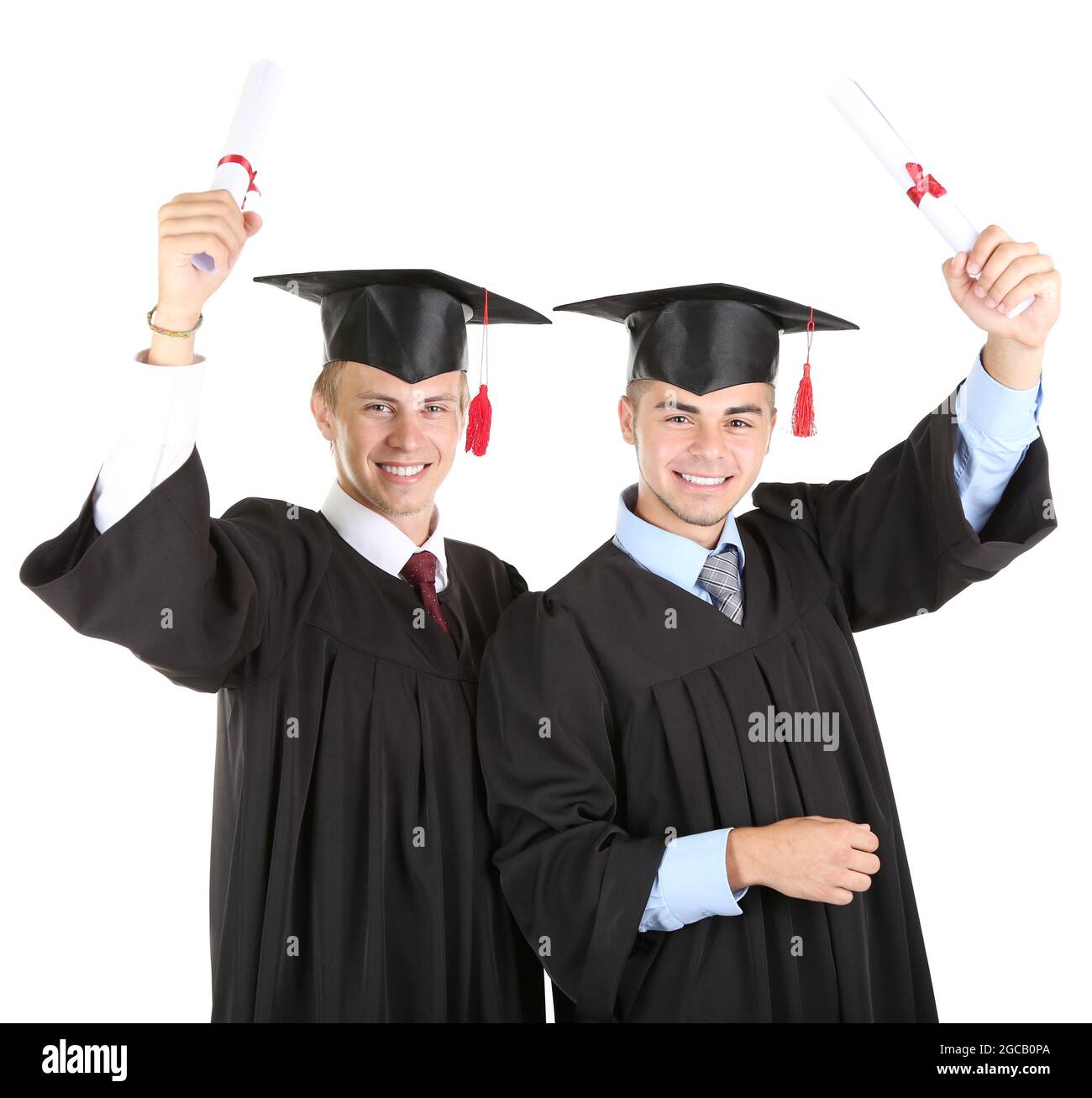 Two happy graduating students isolated on white Stock Photo - Alamy